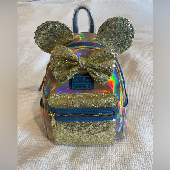 Loungefly | Bags | Nwt Loungefly Yellow Iridescent Backpack Disney ...